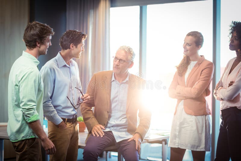 Business People Having Discussion with Each Other Stock Photo - Image ...