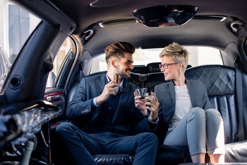 Business People Having Drink in Limo Stock Image - Image of couple ...