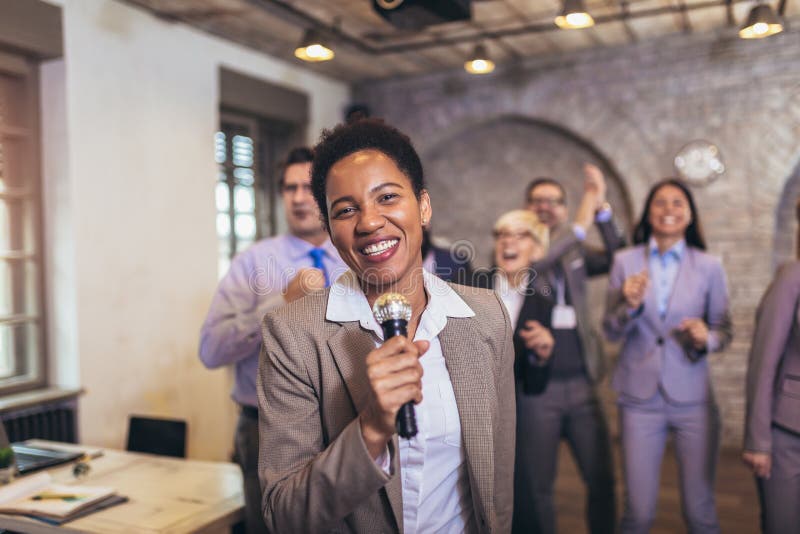Business People Having Karaoke Party at Co-working Space, Singing ...