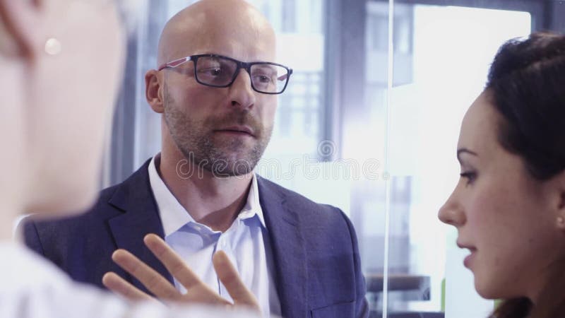 Business People Having Serious Conversation in Office Stock Footage ...