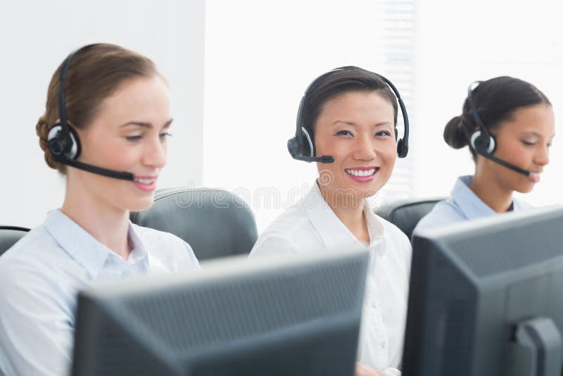 Business People with Headsets Smiling at Camera Stock Image - Image of ...