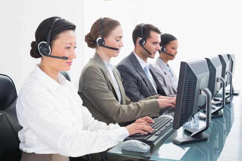 Business People with Headsets Using Computers Stock Photo - Image of ...