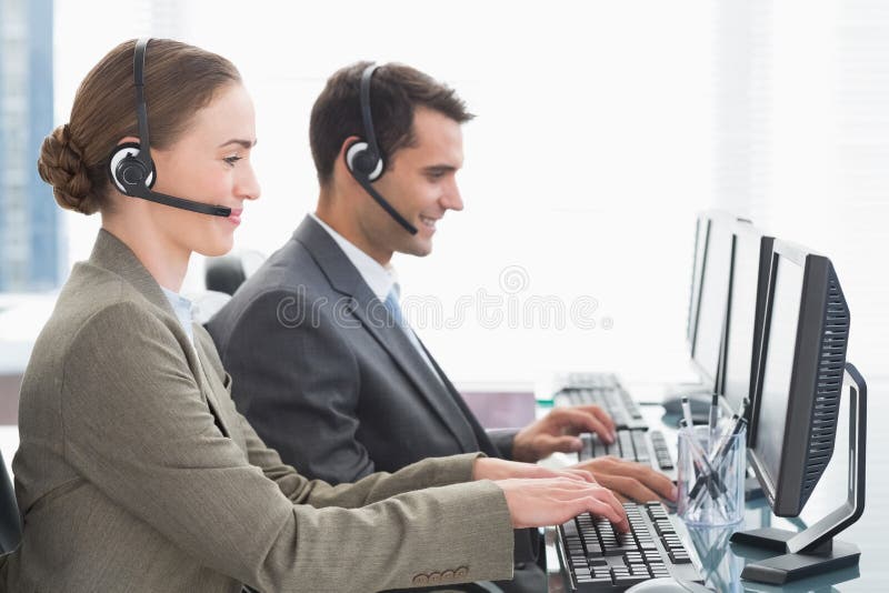 Business People with Headsets Using Computers Stock Photo - Image of ...