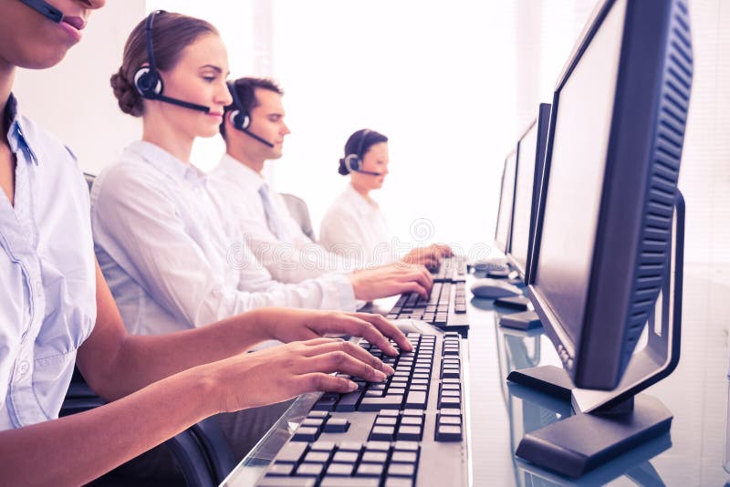 Business People with Headsets Using Computers Stock Image - Image of ...