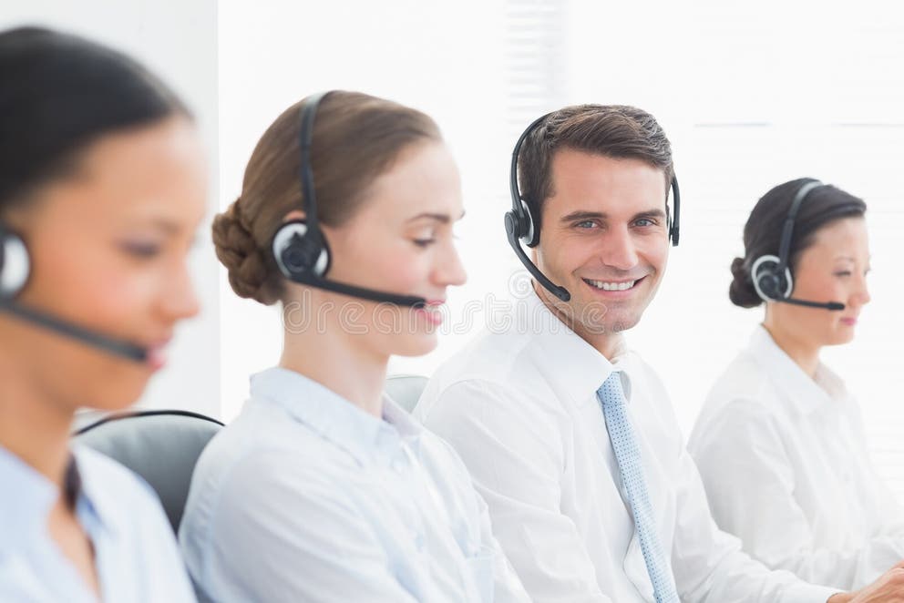 Business People with Headsets Using Computers Stock Photo - Image of ...