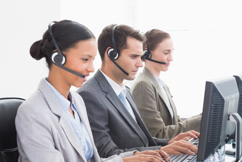 Business People with Headsets Using Computers Stock Image - Image of ...