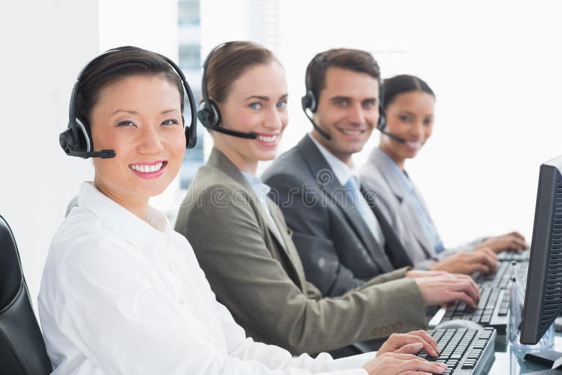 Business People with Headsets Using Computers Stock Photo - Image of ...