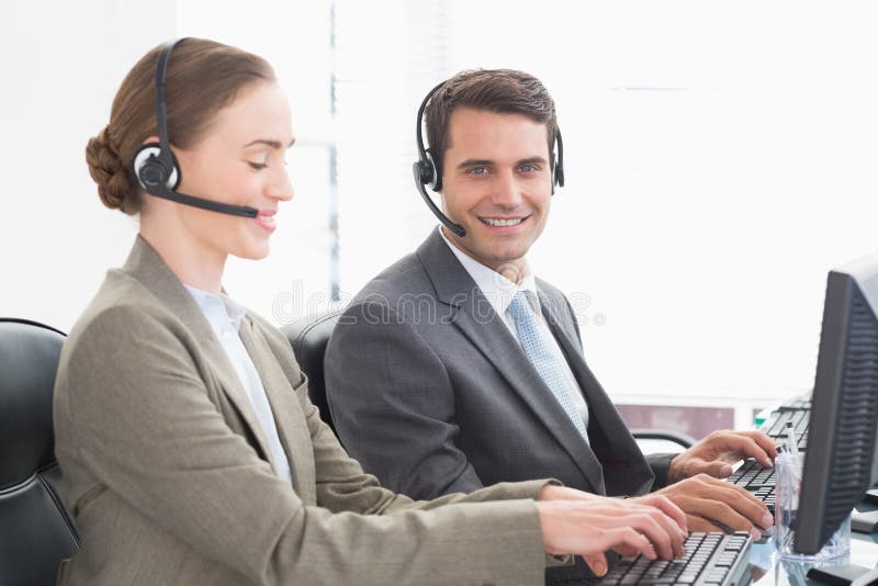 Business People with Headsets Using Computers Stock Photo - Image of ...