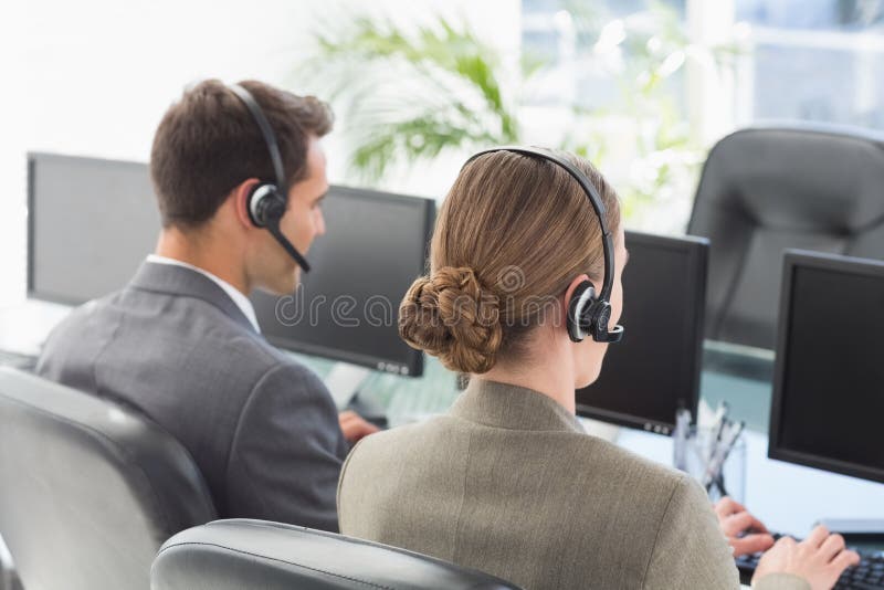 Business People with Headsets Using Computers Stock Photo - Image of ...