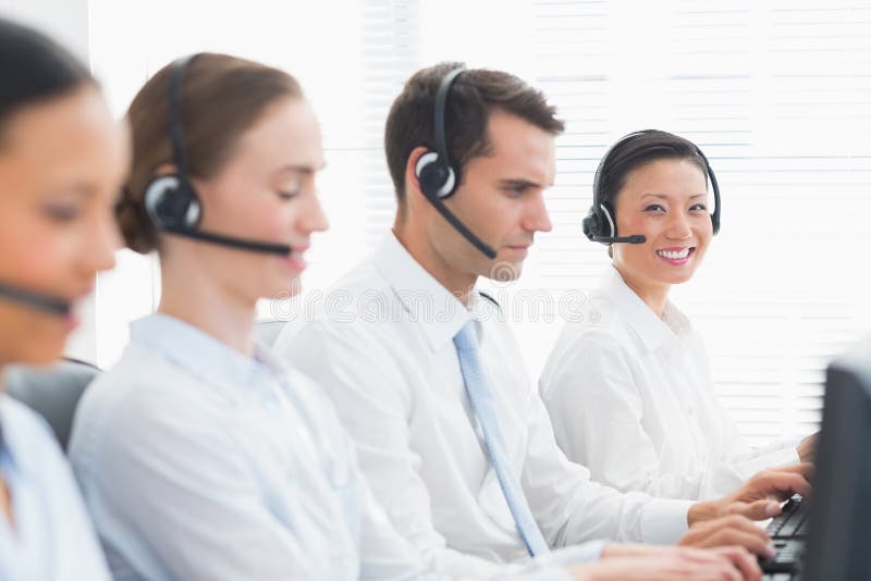 Business People with Headsets Using Computers Stock Image - Image of ...