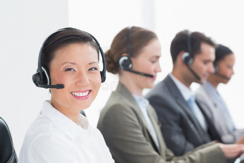 Business People with Headsets Using Computers Stock Image - Image of ...