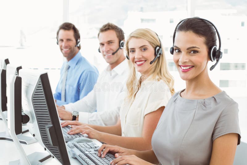 Business People with Headsets Using Computers in Office Stock Image ...