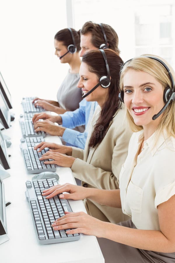 Business People with Headsets Using Computers in Office Stock Image ...
