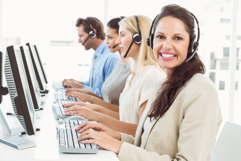 Business People with Headsets Using Computers in Office Stock Photo ...