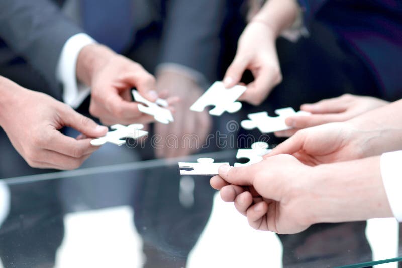 Team on puzzle pieces stock photo. Image of corporate - 18556900