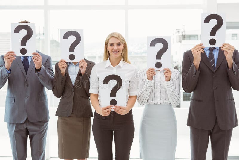 Business People Holding Question Mark Signs in Office Stock Photo ...