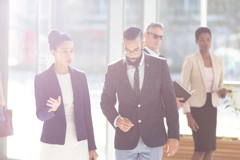 Business People Interacting with Each Others in Office Lobby Stock ...