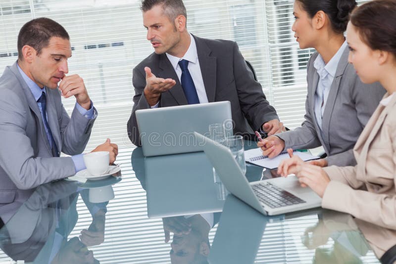 Business People Interacting and Working Together Stock Image - Image of ...