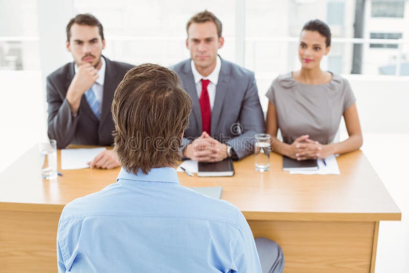 Business People Interviewing Man in Office Stock Photo - Image of ...