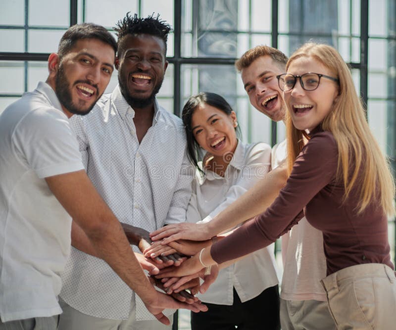Business People Joining Hands in the Office. Concept of Teamwork and ...