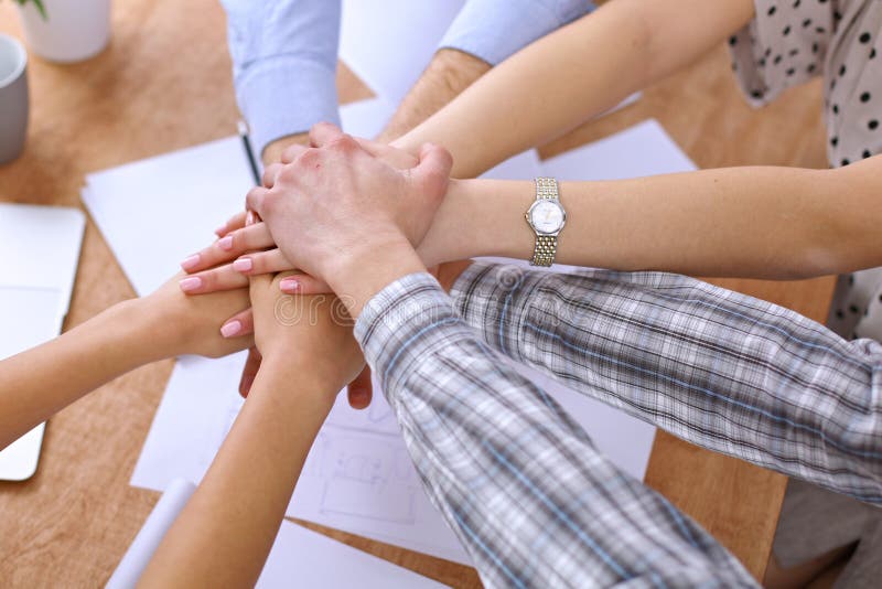 Business People Joining Hands Over Table Stock Photo - Image of ...