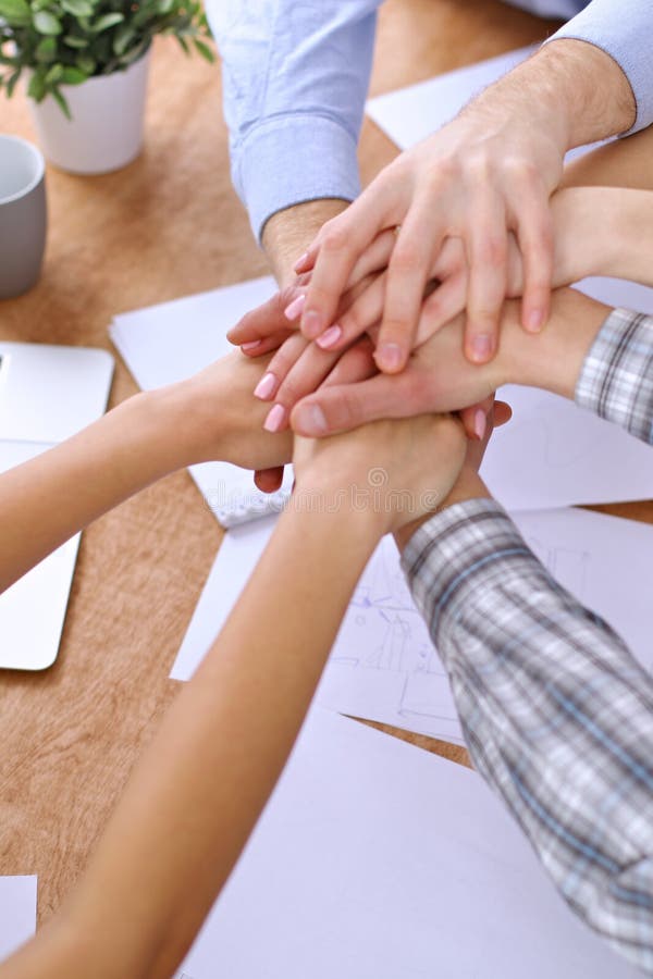 Business People Joining Hands Over Table Stock Image - Image of ...