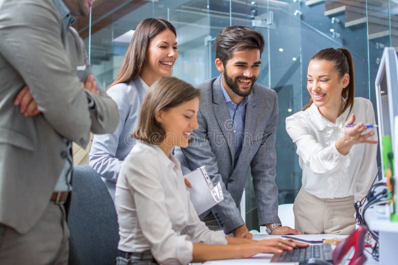 Business People Laughing while Checking Successful Project on Computer ...