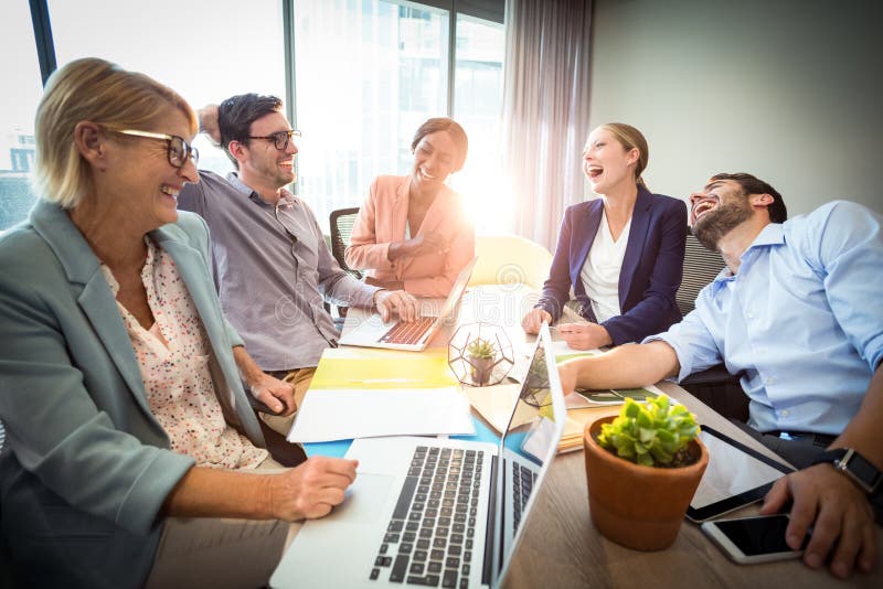 Business People Laughing during a Meeting Stock Image - Image of ...