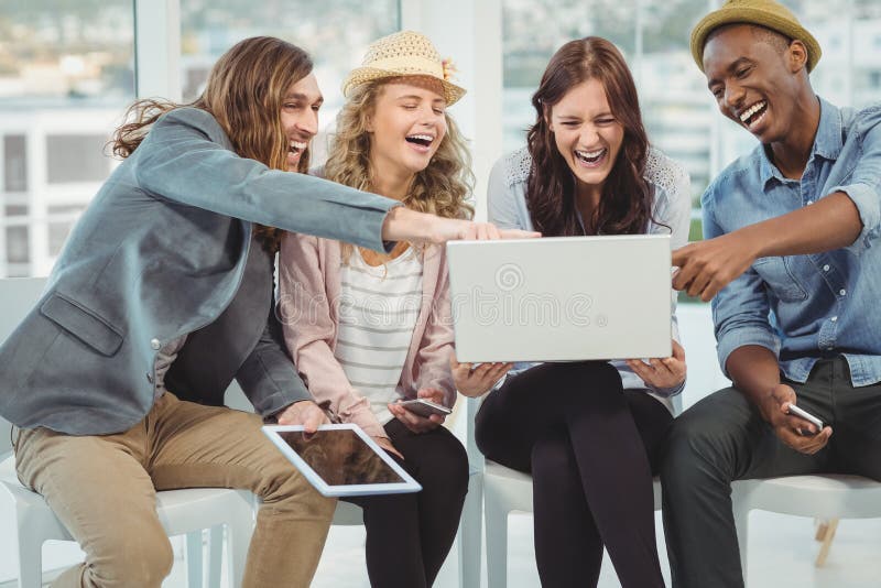 Business People Laughing while Pointing at Laptop Stock Image - Image ...
