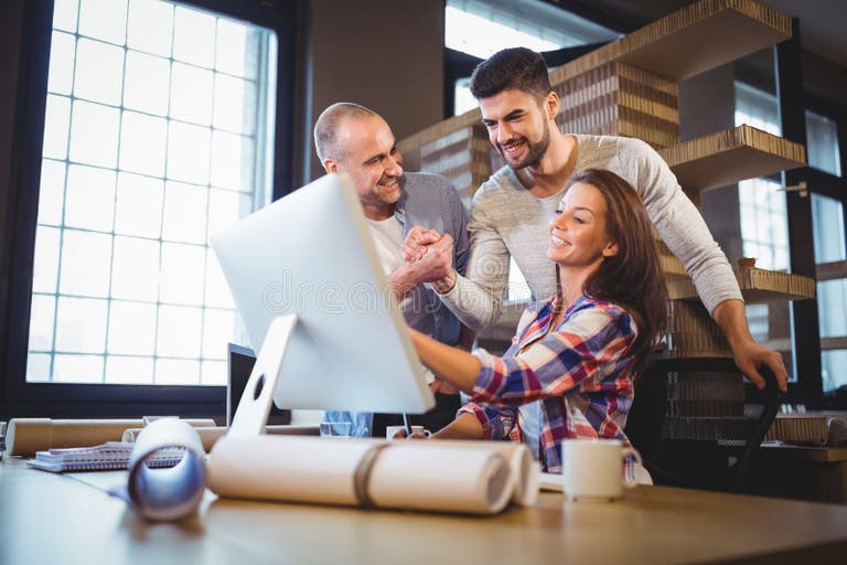Business People Looking at Computer in Creative Office Stock Image ...