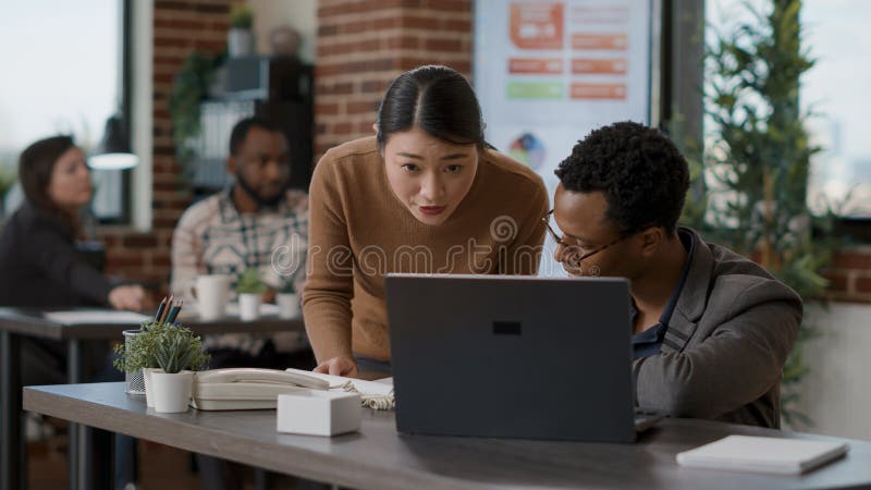 Business People Looking at Documents Charts and Laptop Stock Image ...