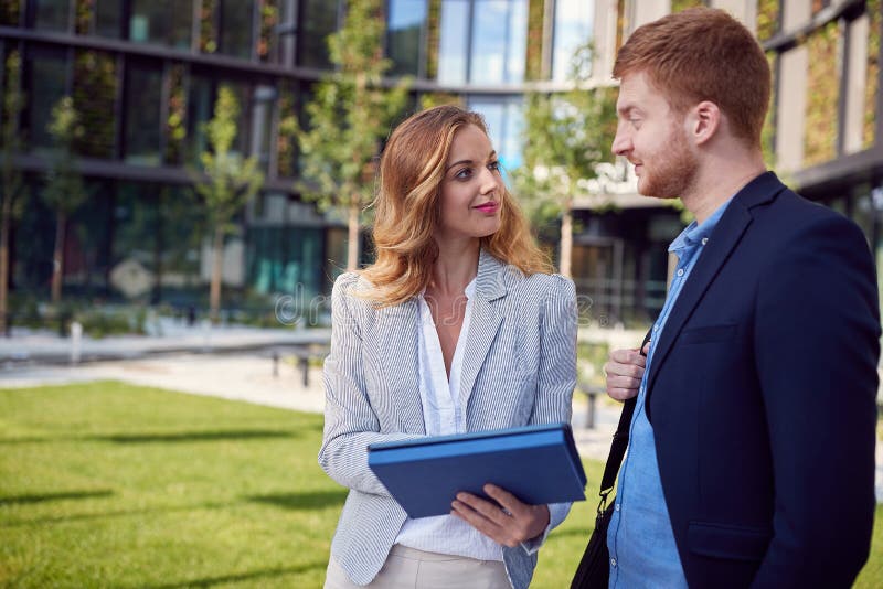 Business People Looking Interested Each Other in Front of a Building ...
