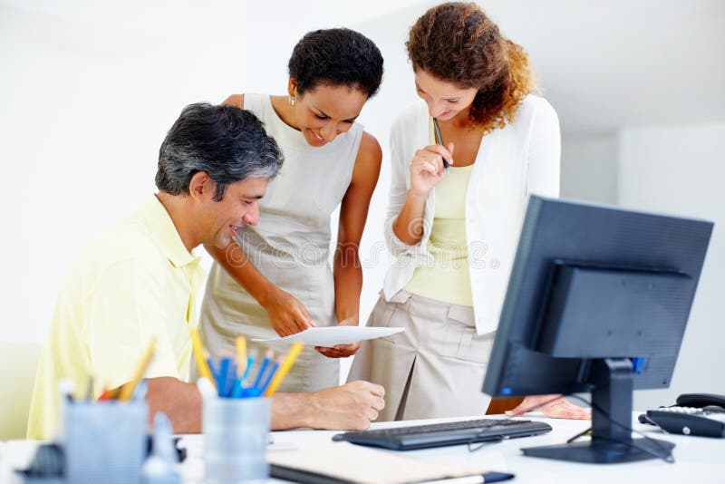 Business People Looking at Paperwork. Business People Looking at ...