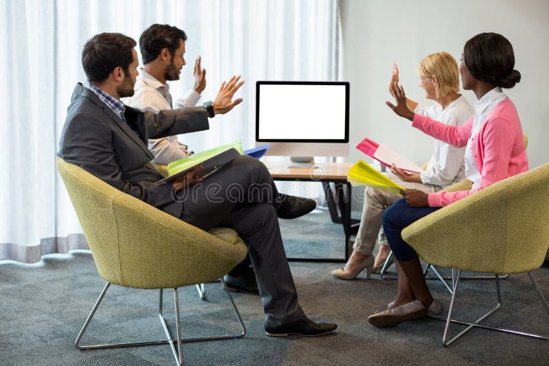 Business People Looking at a Screen during a Video Conference Stock ...