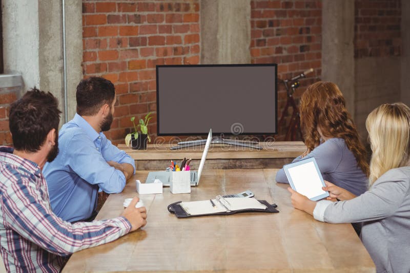 Business People Looking Towards Screen while Sitting in Office Stock ...