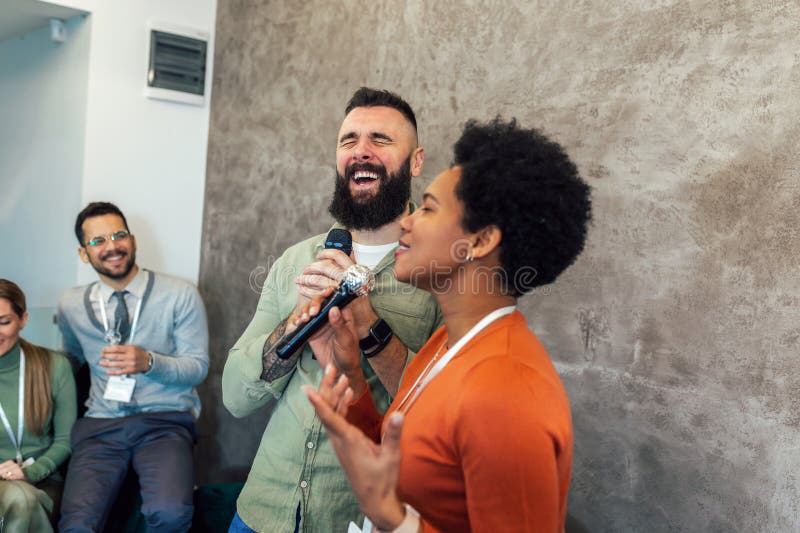 Business People Singing Karaoke in Modern Office Stock Image - Image of ...