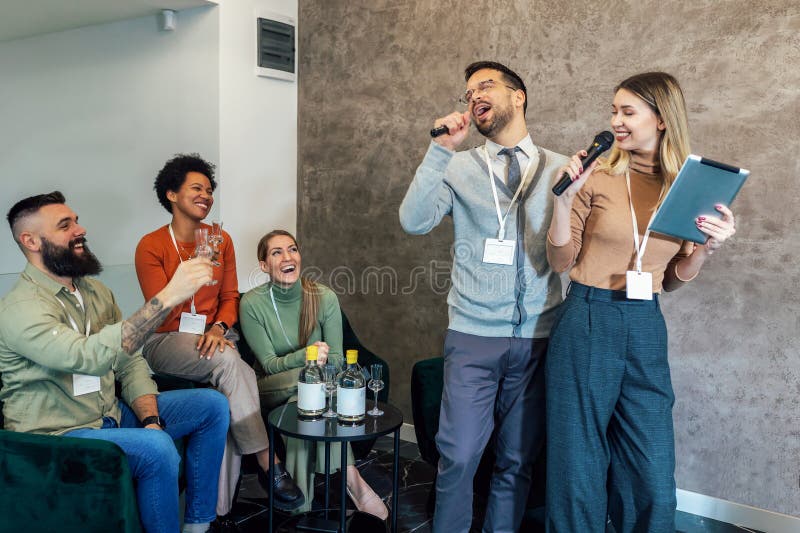 Business People Singing Karaoke in Modern Office Stock Photo - Image of ...