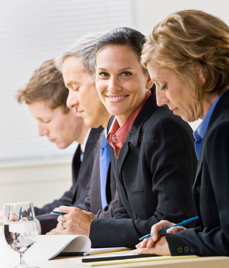 Four Business People Meeting in a Conference Room. Stock Image - Image ...