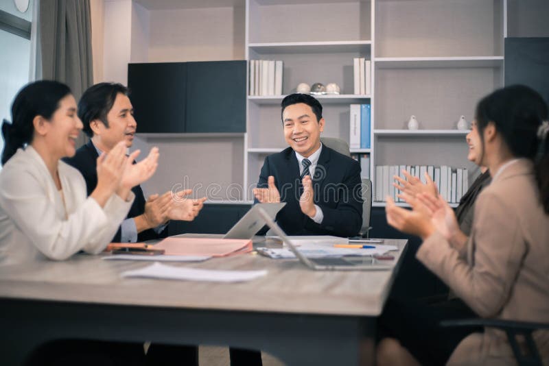 Business People Meeting and Discussing Documents and Ideas at Meeting ...