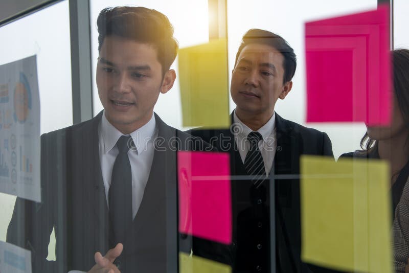 Business People Meeting at Office and Use Post it Notes To Share Stock ...