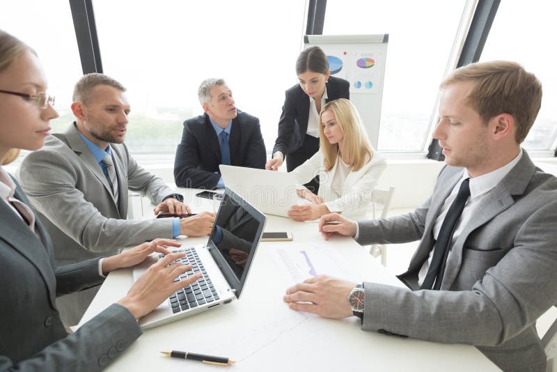 Business people at meeting stock photo. Image of person - 148030486
