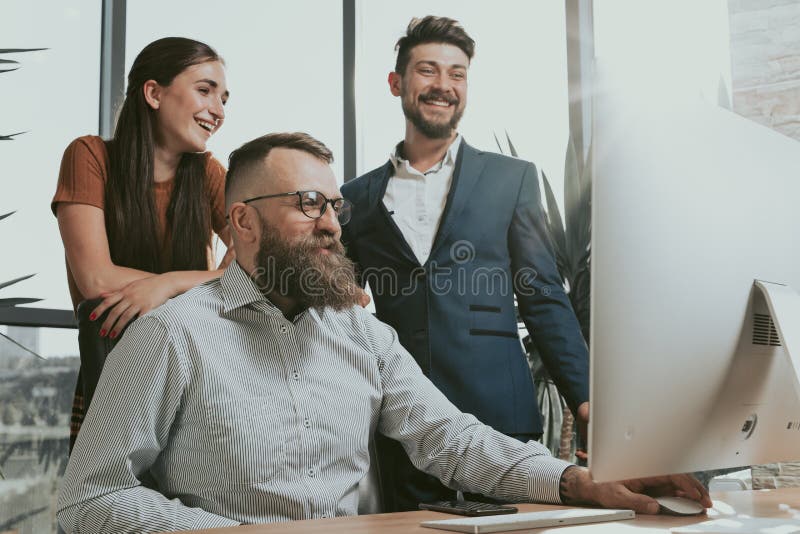 Business People in a Modern Office Discuss Work in Front of the Display ...