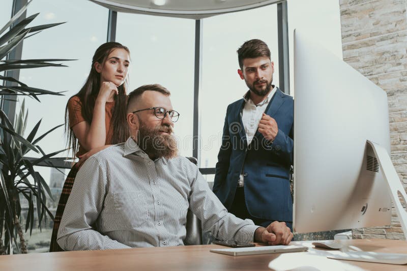 Business People in a Modern Office Discuss Work in Front of the Display ...