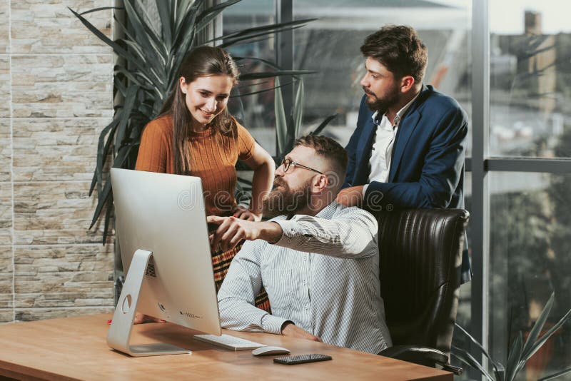 Business People in a Modern Office Discuss Work in Front of the Display ...