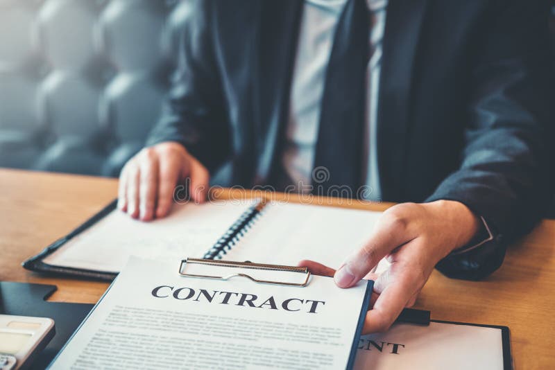 Business People Negotiating a Contract between Two Colleagues Stock ...