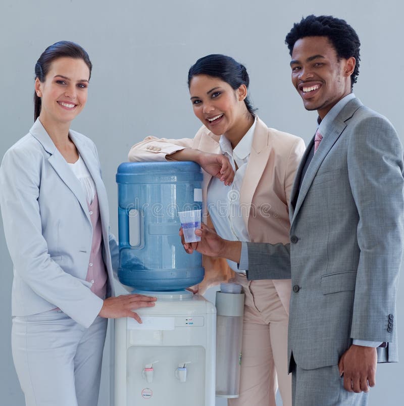 Business People Next To a Water Cooler Stock Photo - Image of indoors ...