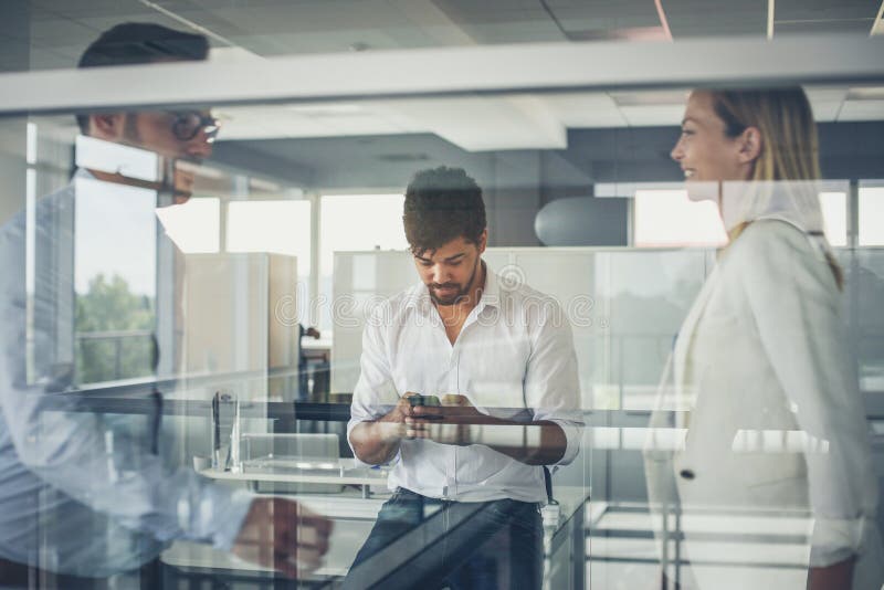 Business People in Office Having Conversation and Using Technology ...