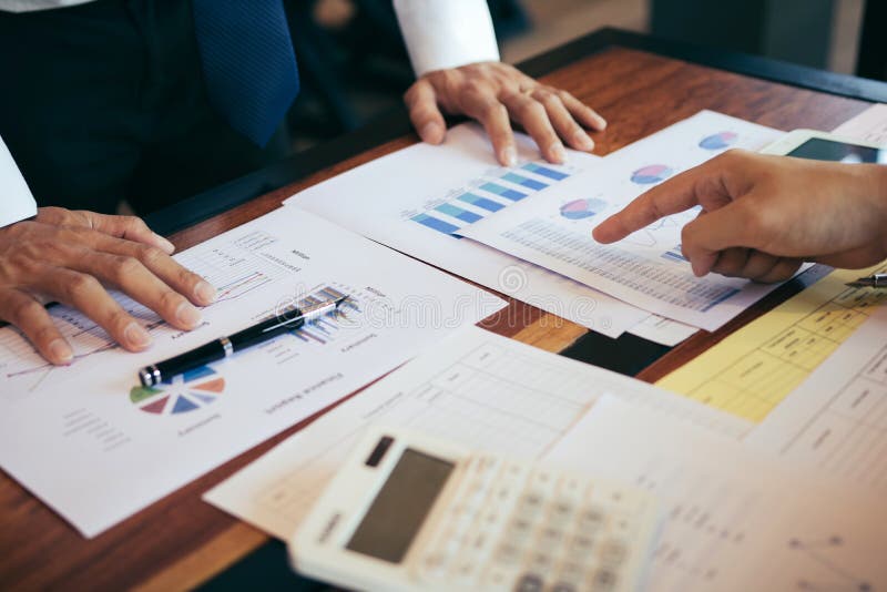 Business People Pointing on Statistic Number Result and Analysis ...