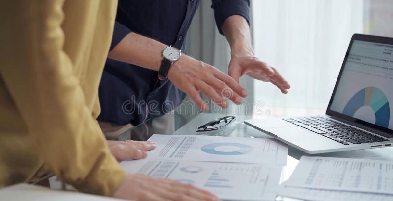 Business People, Professionals Analyzing Financial Charts and Data on a ...