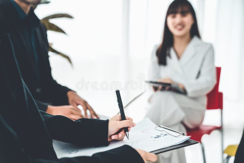 Business People Proficiently Discuss Work Project while Sitting in ...